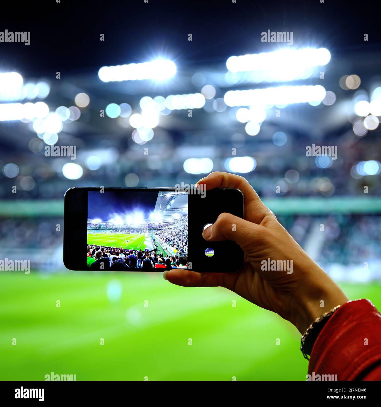 Using a smartphone camera for photographing a football match in the ...