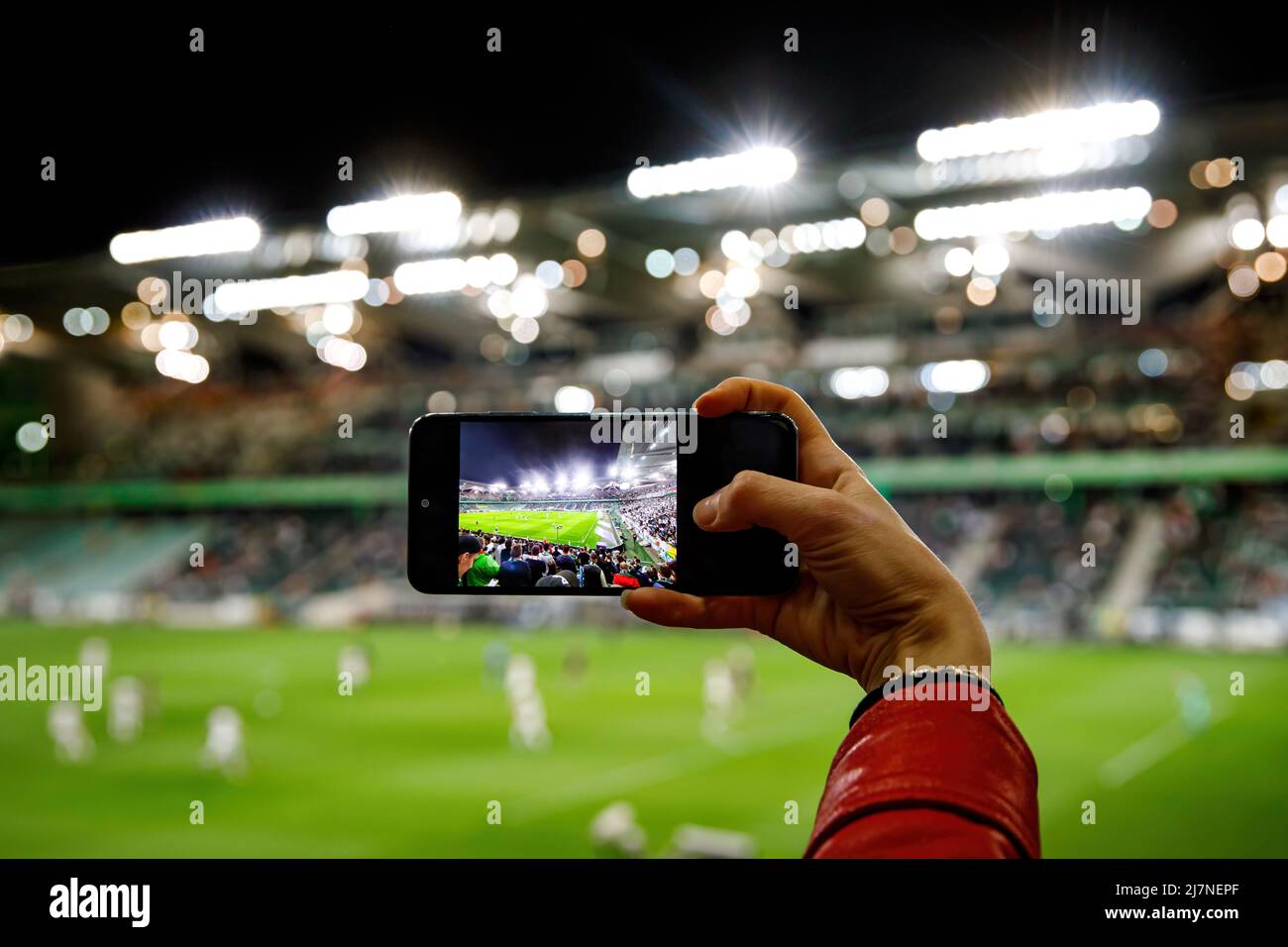 Using a smartphone camera for photographing a football match in the ...