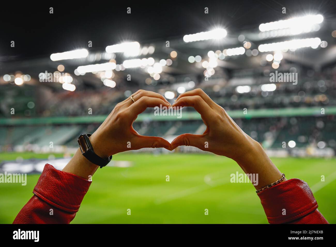 She loves this team. Heart shape for the favorite football club during ...