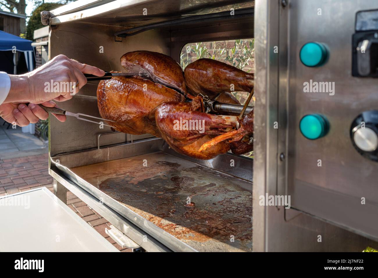 crispy rotisserie turkey in outdoor cooker Stock Photo - Alamy