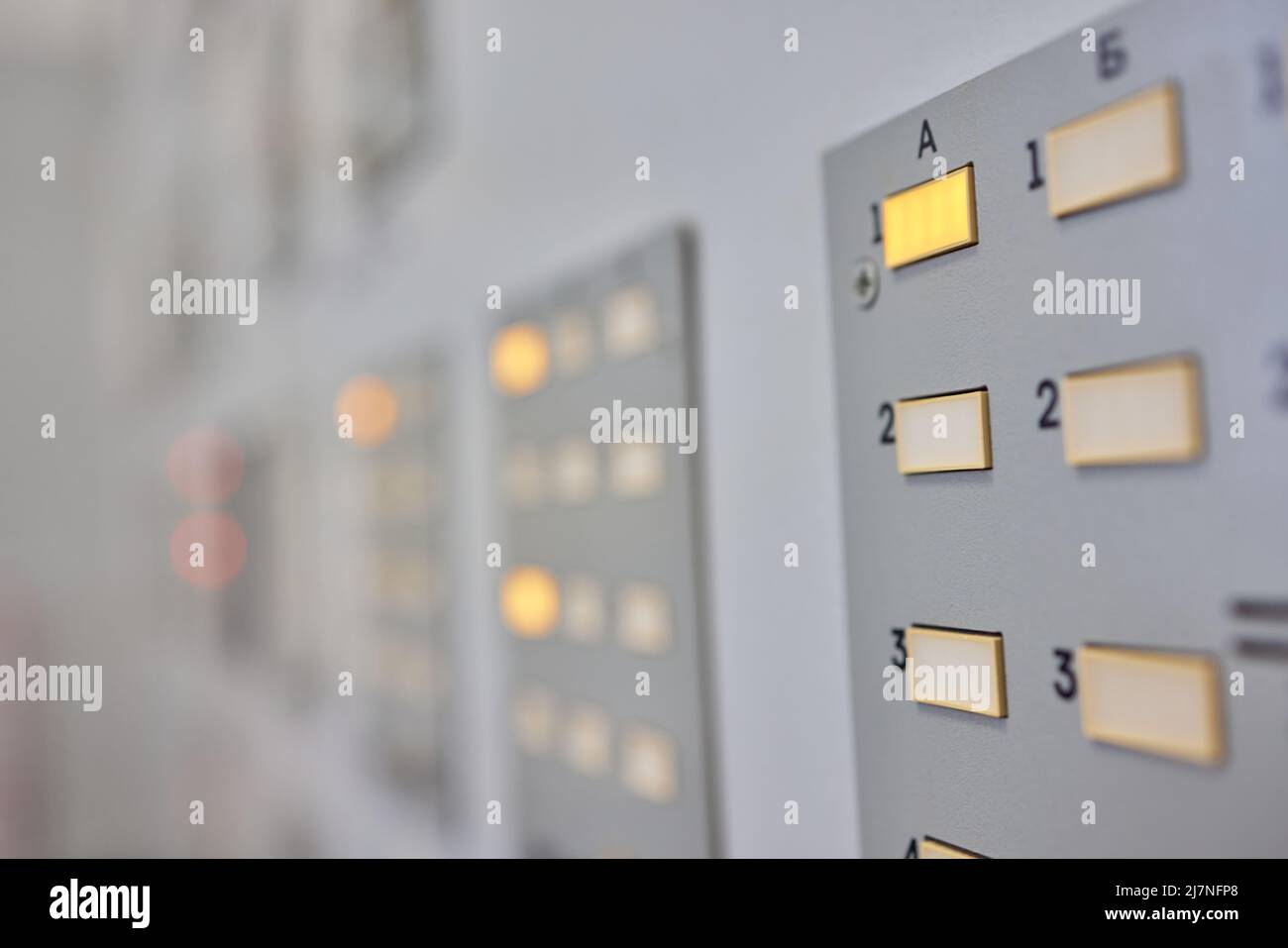 Electrical control cabinet on gray wall close-up Stock Photo - Alamy