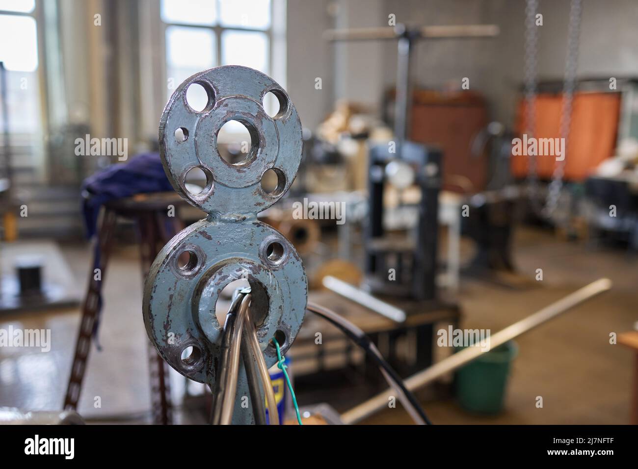 Close up hand heavy industrial worker is working on metal work factory ...