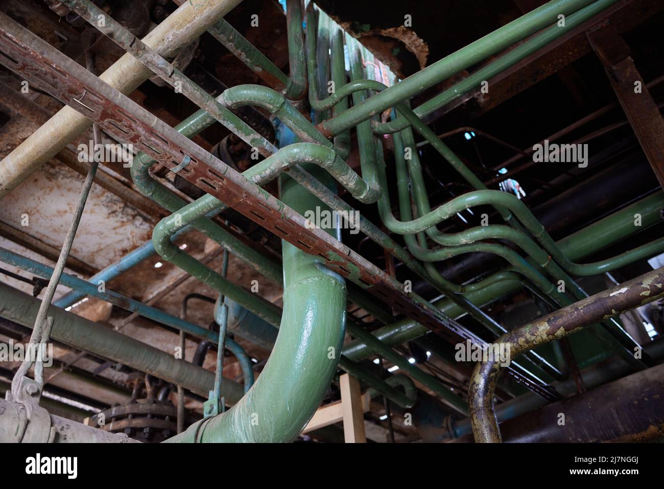 Close-up at pipeline valve which is using to control production process ...