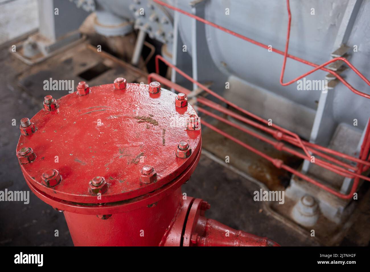 Close-up at pipeline valve which is using to control production process ...