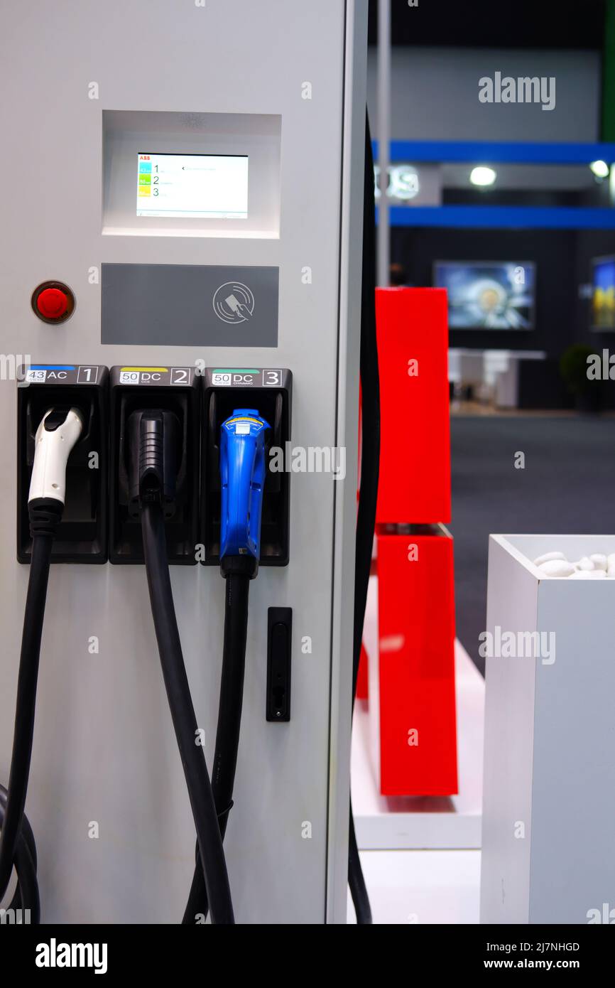 EV charging station with three charging units indoor Stock Photo - Alamy