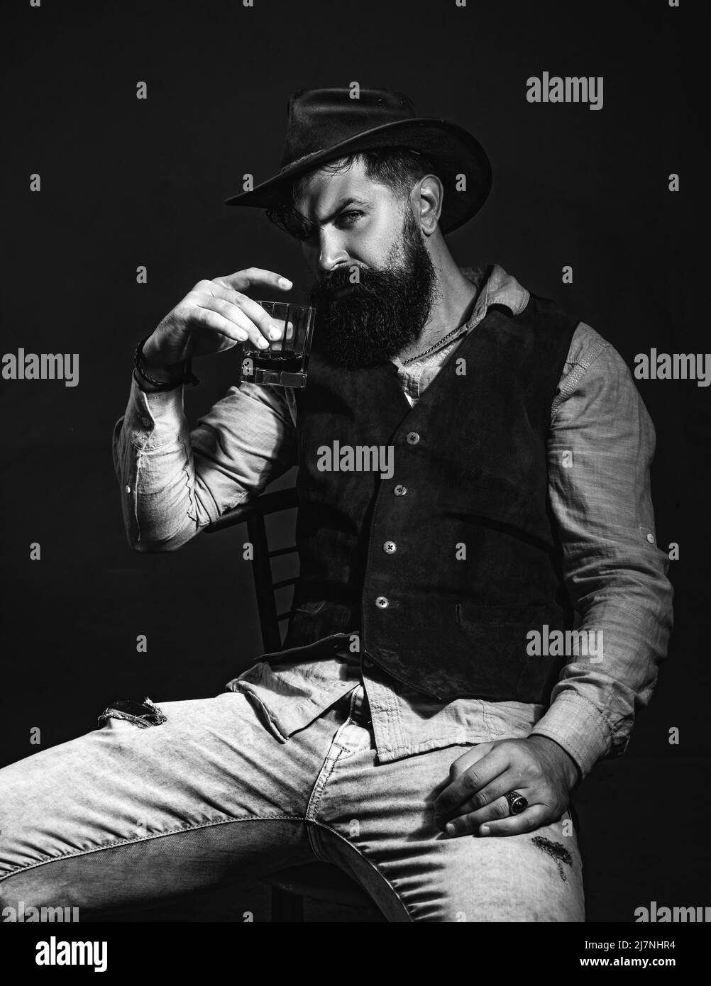 Sommelier man. Confident well-dressed man with glass of whisky. Retro ...