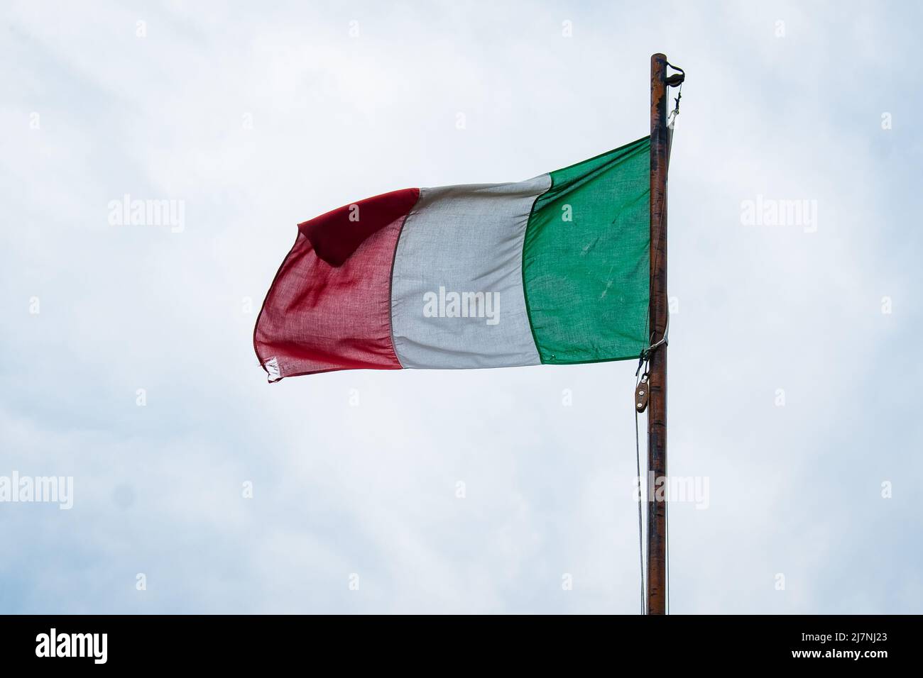 Flag of Italy on sky background. Italian flag waving in wind Stock ...