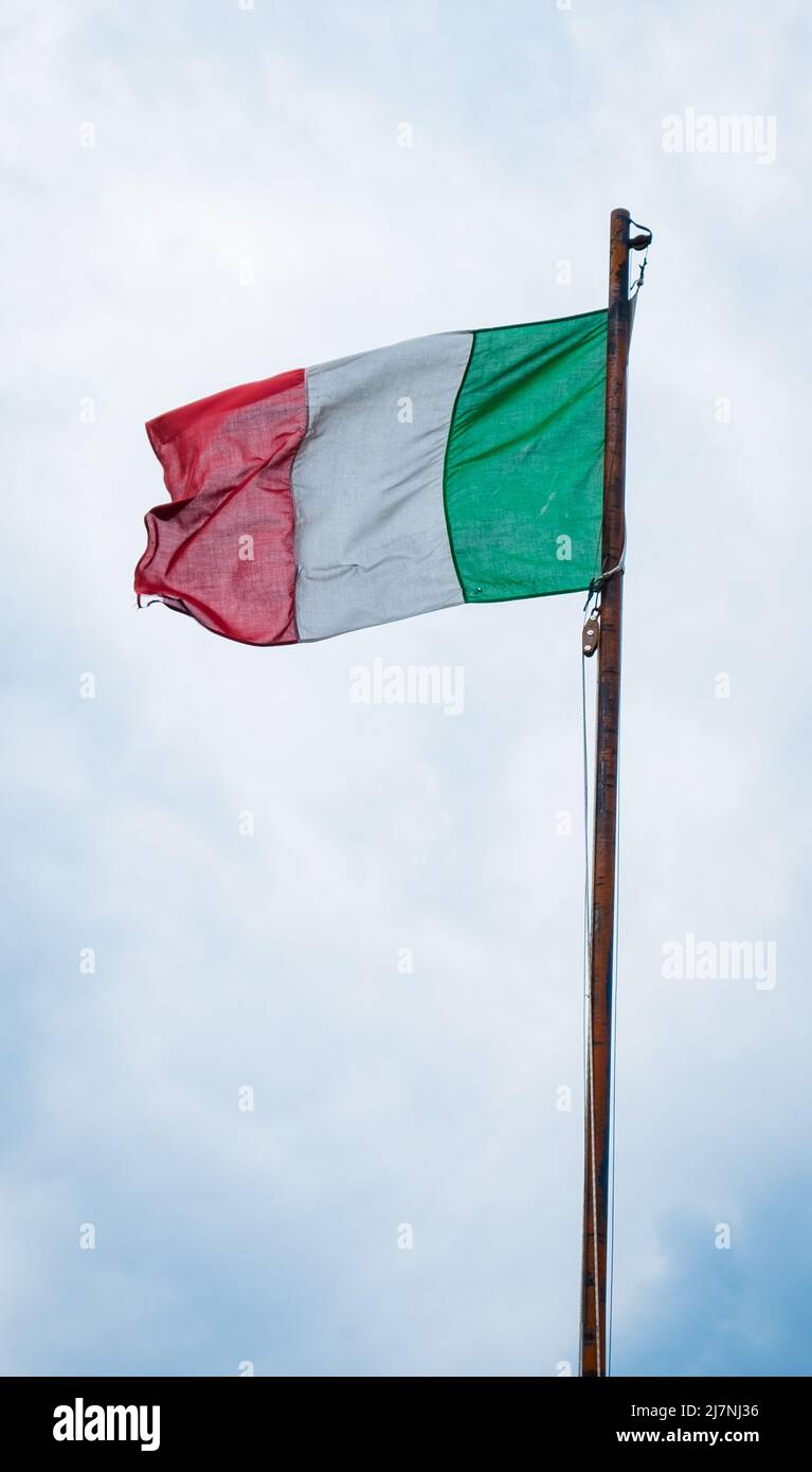Flag of Italy on sky background. Italian flag waving in wind Stock ...