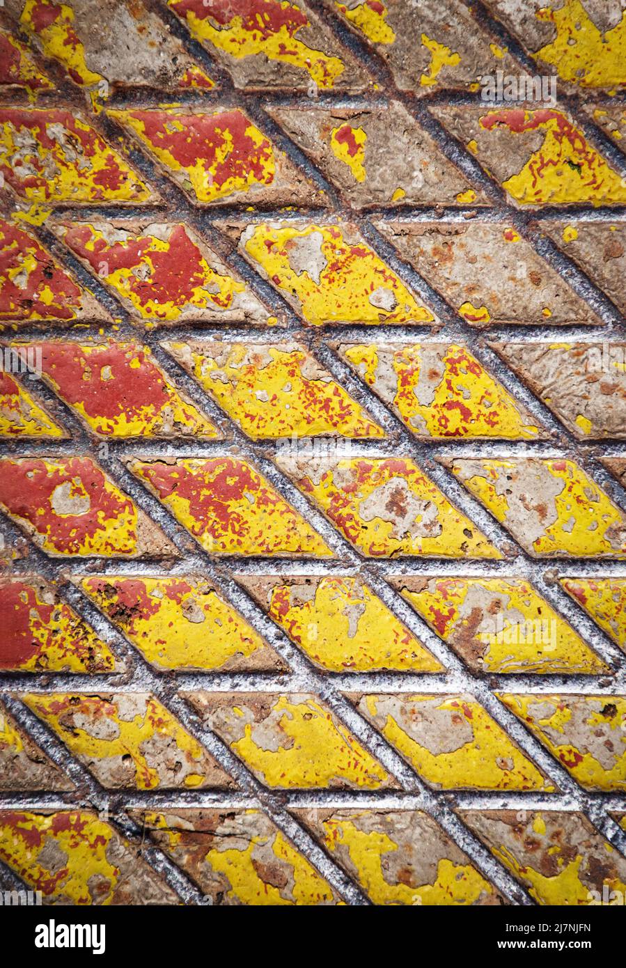 abstract background or texture Detail of a yellow painted iron hatch ...