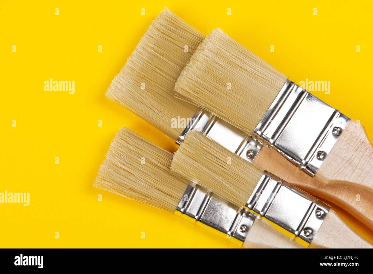 Set of different clean paint brushes on yellow background Stock Photo ...