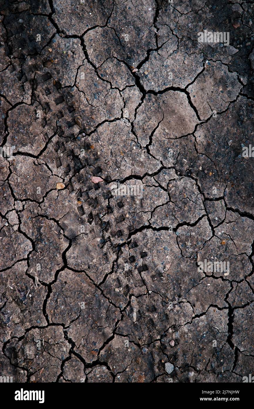 background or texture dry clay with tire cyclo tracks Stock Photo - Alamy