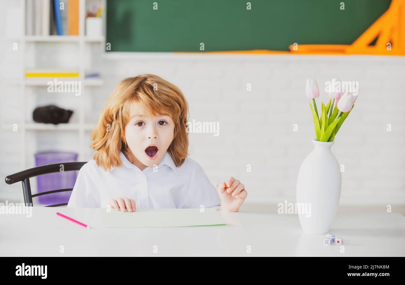 Excited kids in classroom at school. Education and learning for child ...