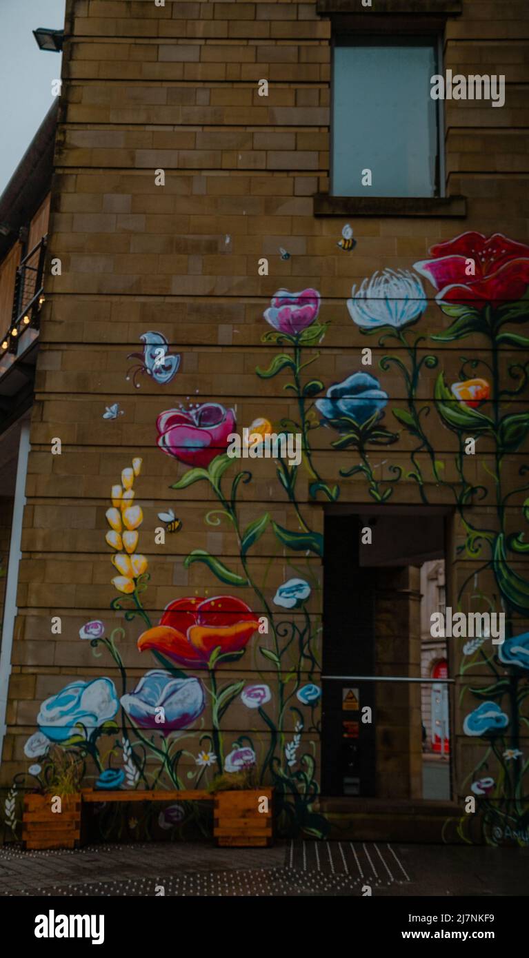 Colour street art containing multiple flowers, located in Deansgate ...