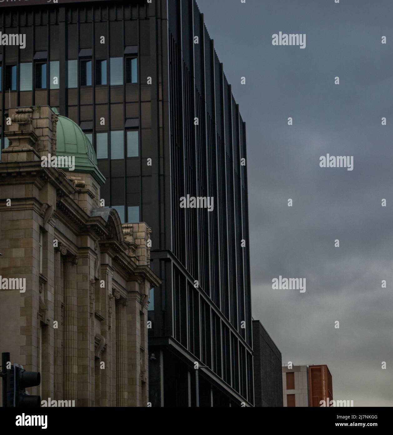 Contrast of both old and new buildings with the stone building and ...