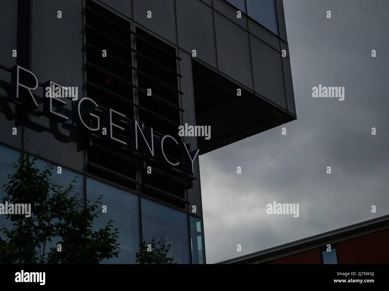 Building with the sign 'Regency' on a modern, glass and metal-fronted ...