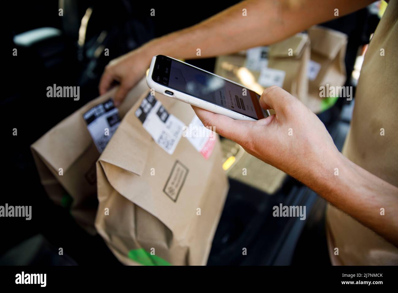 Los Angeles, California, USA. 16th Sep, 2020. A delivery driver scans a ...