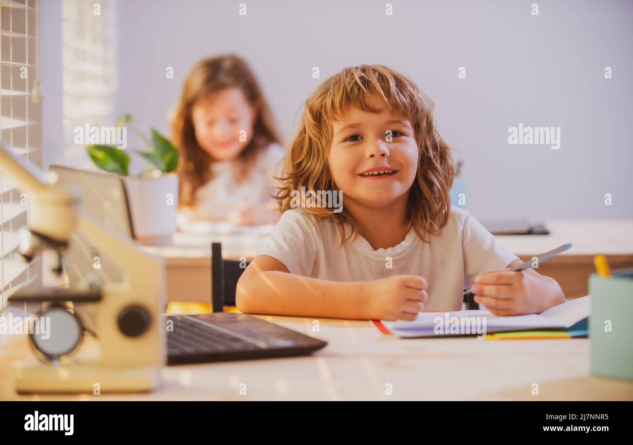 Kids education and study concept. Primary school student in classroom ...