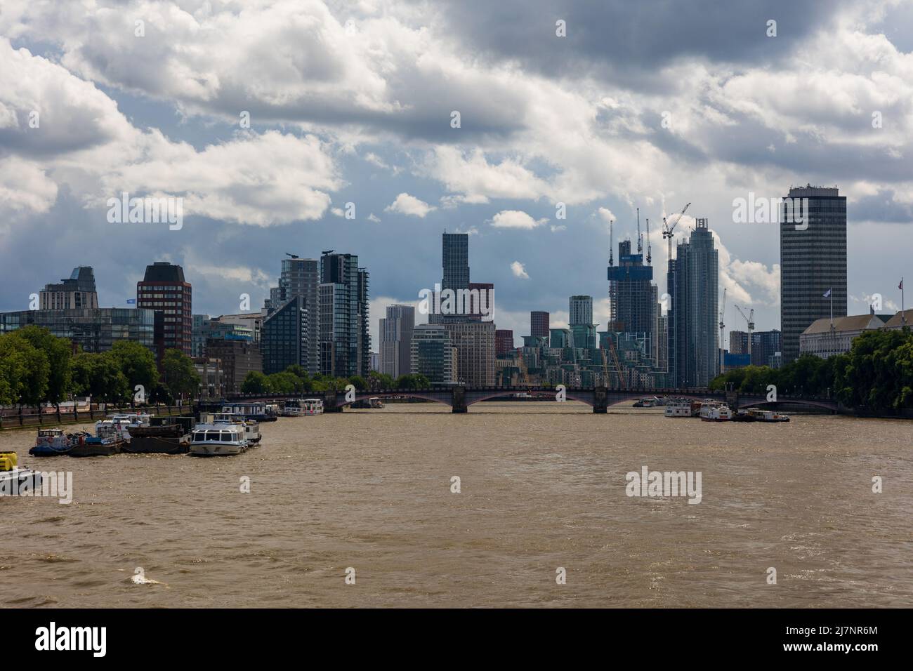 The City of London during the day with the River Thames flowing through ...
