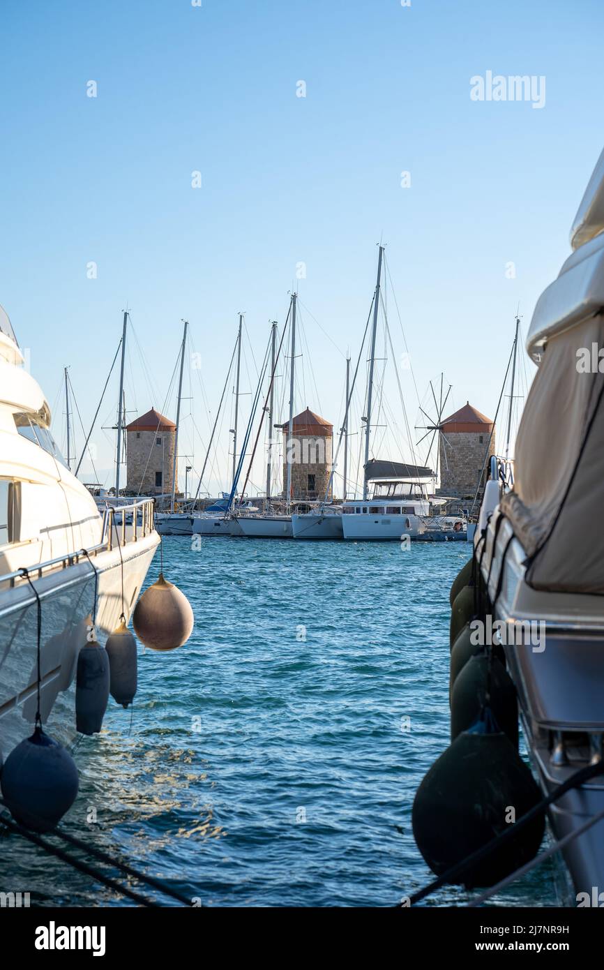 Windmills in Mandraki Harbor in Rhodes Greece Stock Photo - Alamy