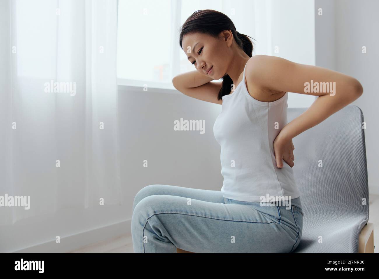 Woman shoulder pain and lower back pain hi-res stock photography and ...
