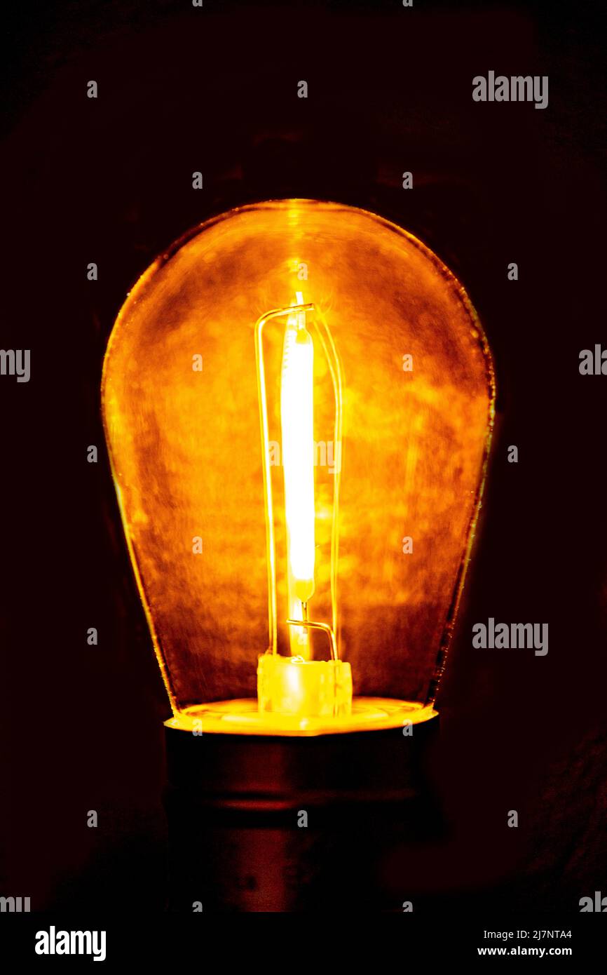 Light bulb against orange hi-res stock photography and images - Alamy