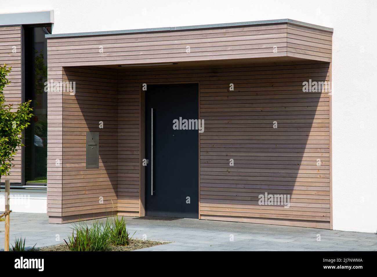 Beautiful entrance to a new residential house with modern front door ...