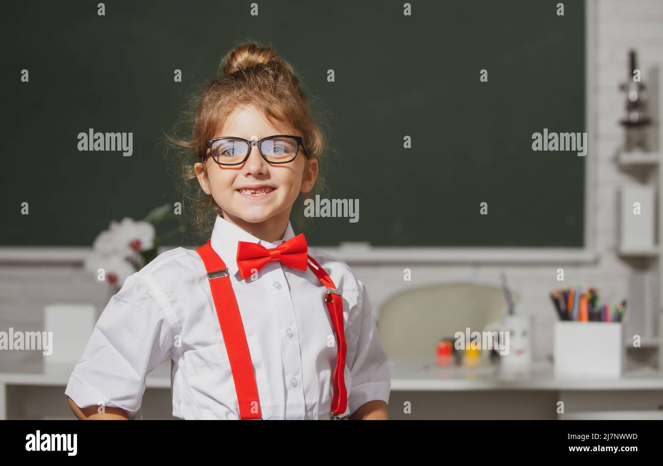 Kid girl learning lesson at school. Elementary school child in class ...