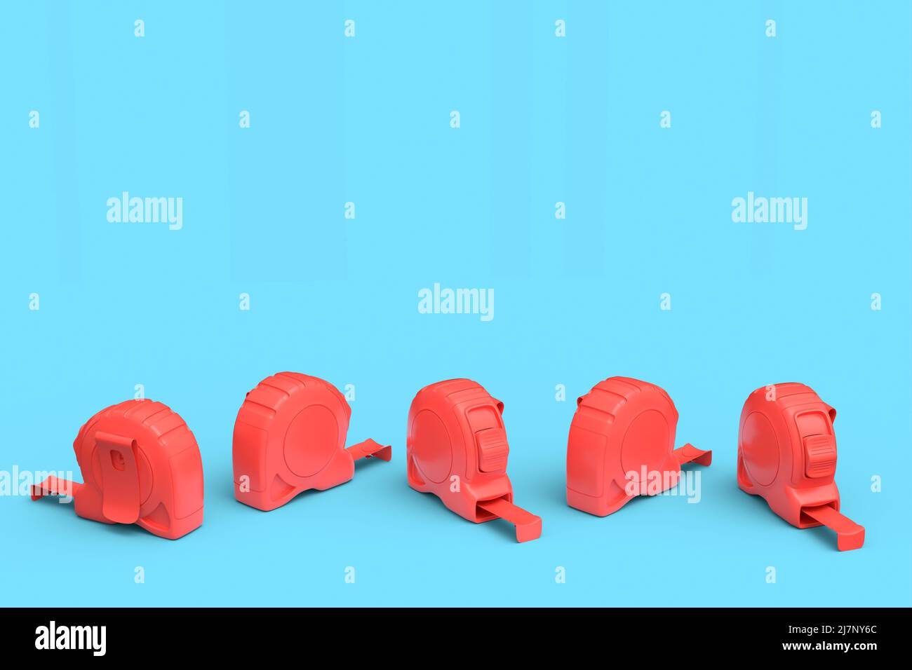 Set of red carpenter measuring tape isolated on blue background with ...