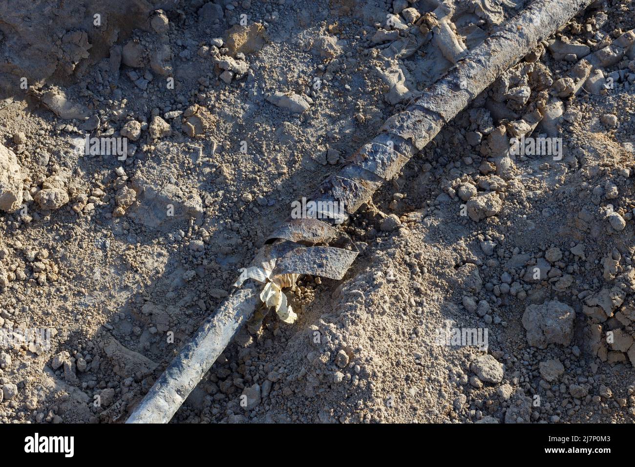 Destroyed cable old rusted, excavation in the ground. Repair work Stock ...