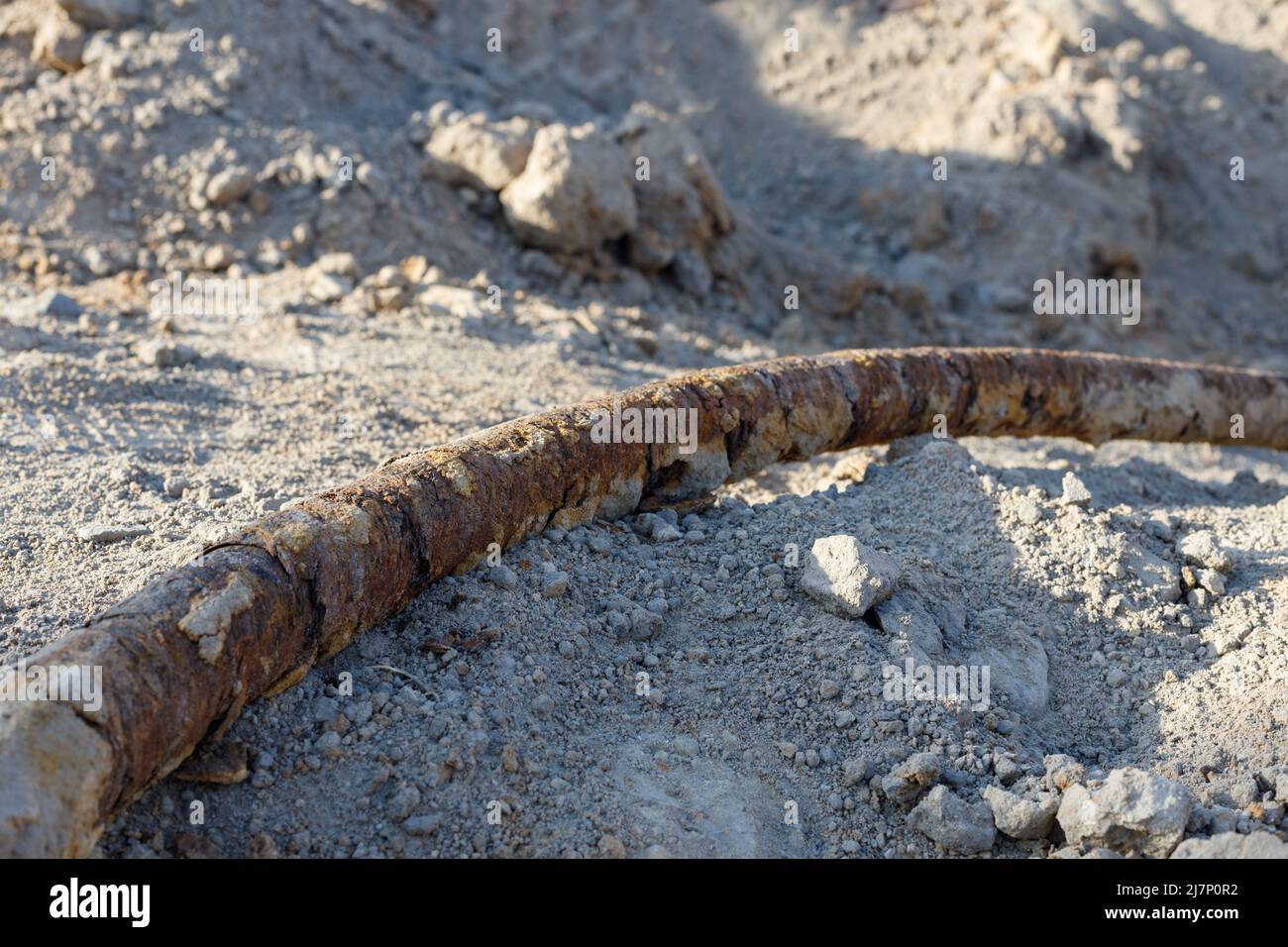 Rusted electrical cable, construction work in the ground Stock Photo ...