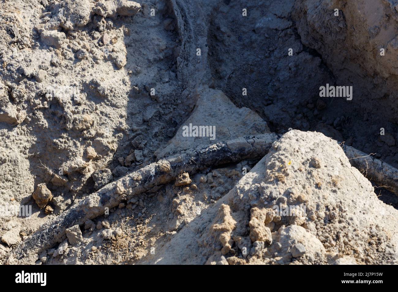 Shot from above, old earth cable. A very old telecommunications or ...