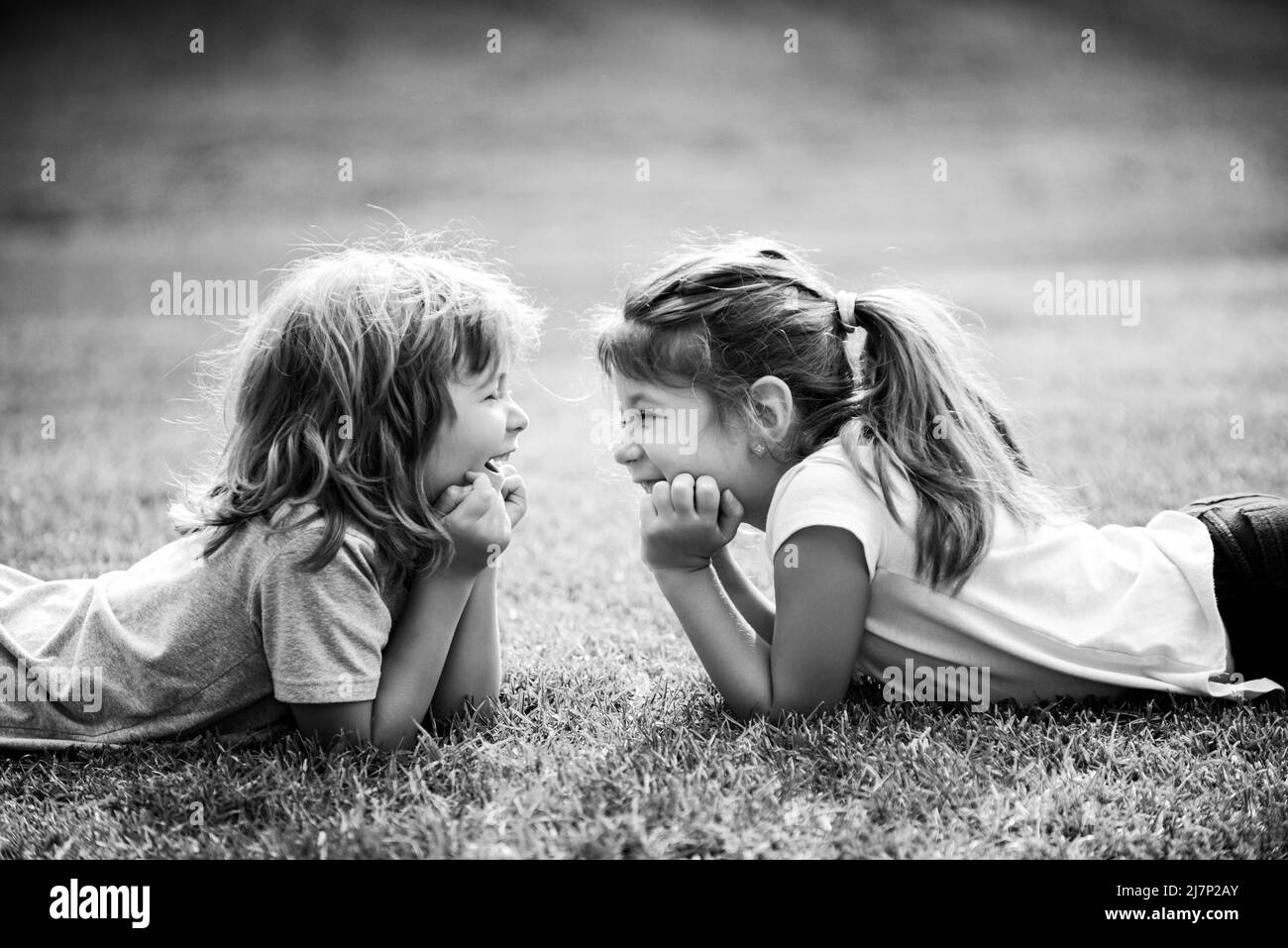 Kids couple in love. Two children on spring field. Adorable happy child ...