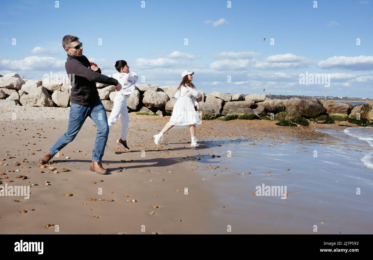 Woman throwing stone sea hi-res stock photography and images - Alamy