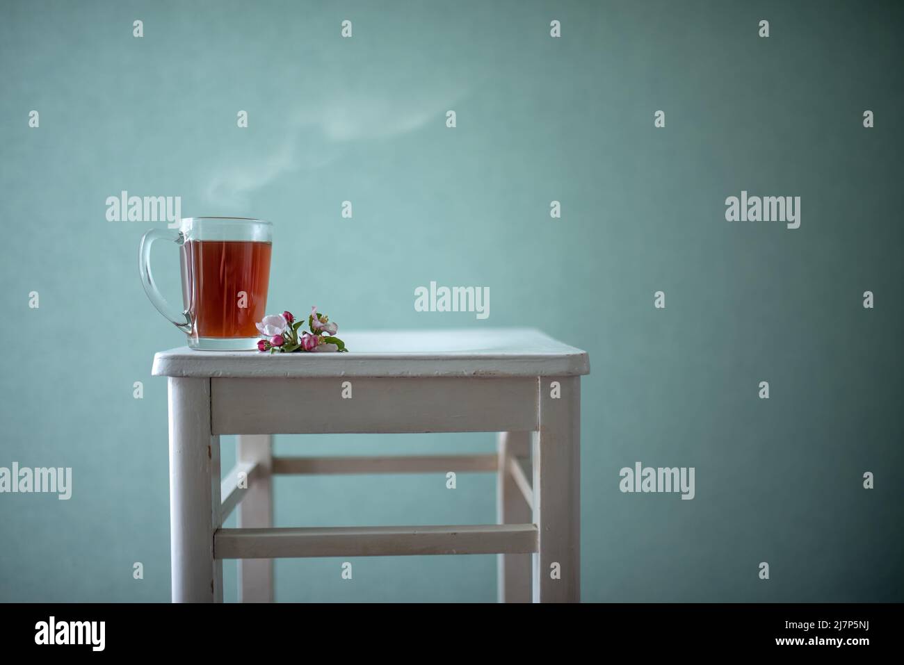 tea cup on white wooden chair Stock Photo - Alamy