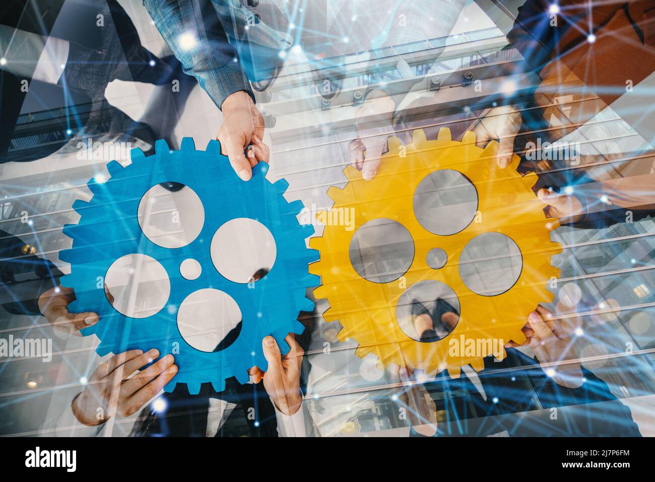 Business team connect pieces of gears like a teamwork and partners ...