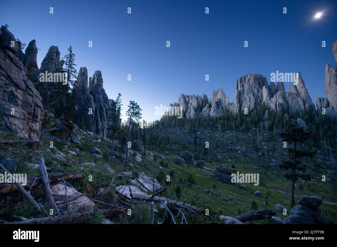 The moon sets as the massive spires of the Black Hills catch the Stock ...