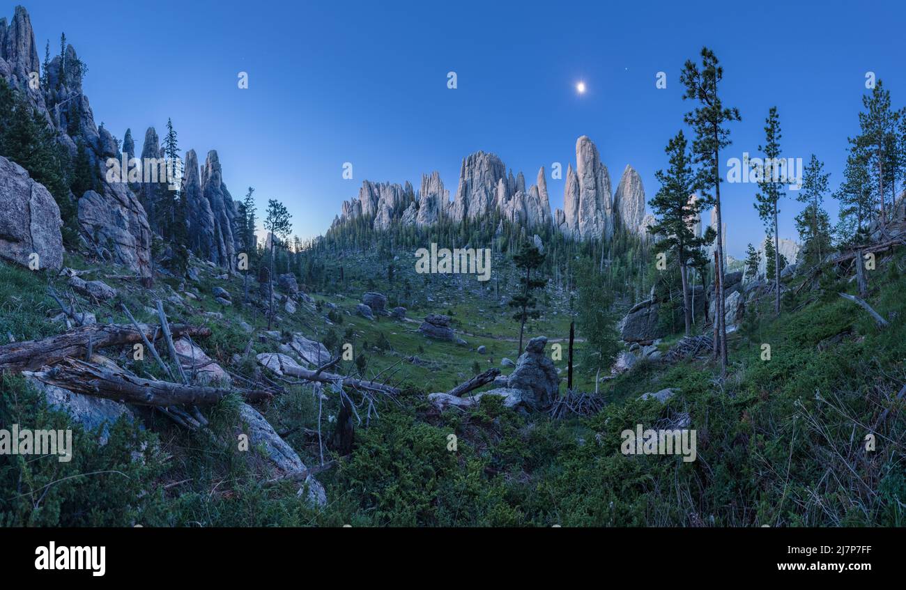 The moon sets as the massive spires of the Black Hills catch the Stock ...