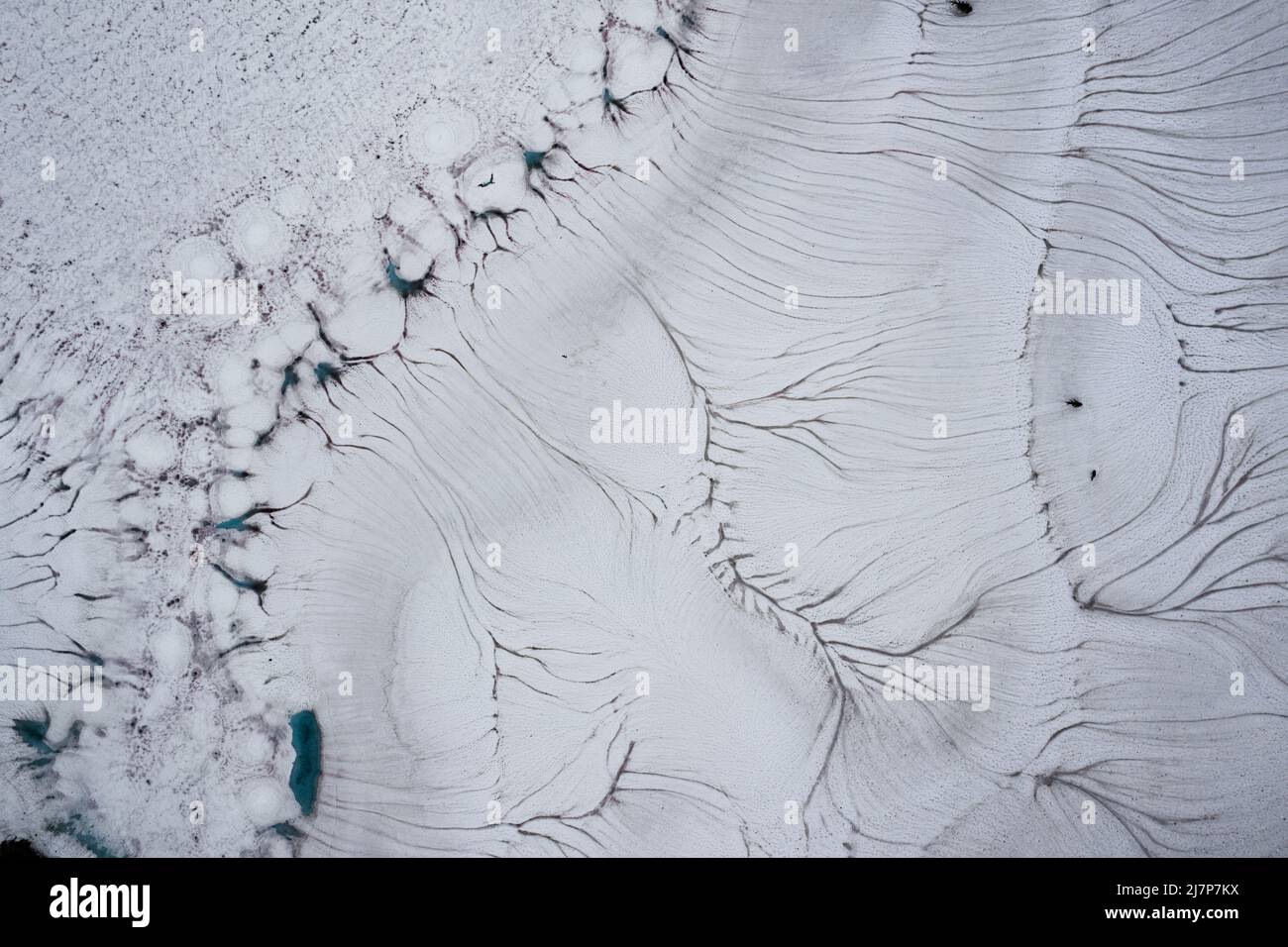 Patterns in the melting snow on Twin Lakes, high in the Washingt Stock ...
