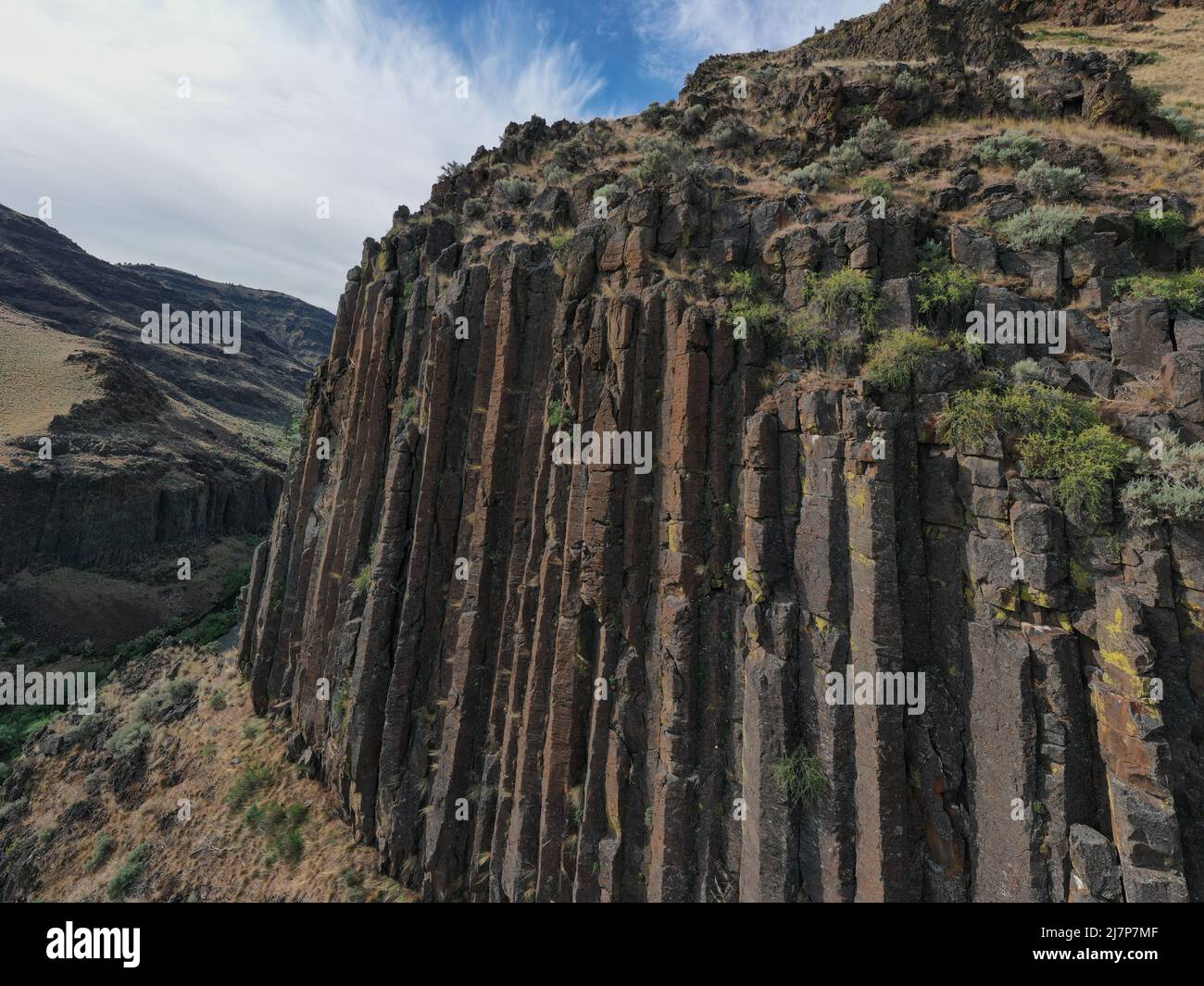 Large stacks of columnar basalt line a pass through the mountain Stock ...