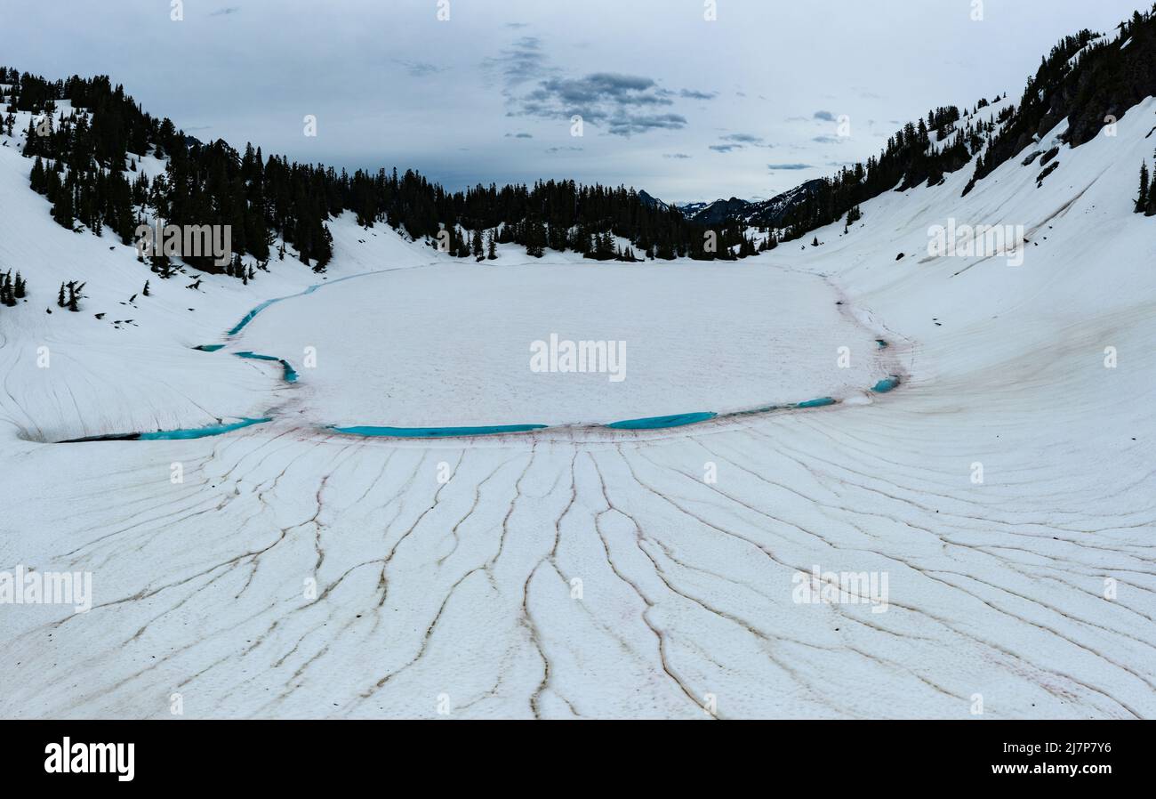 Patterns in the melting snow on Twin Lakes, high in the Washingt Stock ...