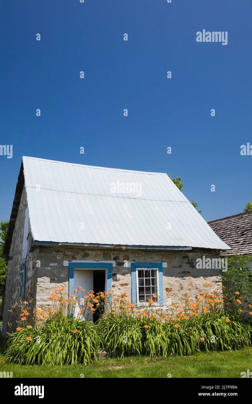 Old small circa 1775 fieldstone home with blue and white trim, grey ...