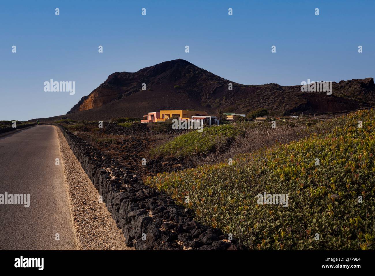 Road with dry stone wall . The Monte Nero Volcano on the background ...