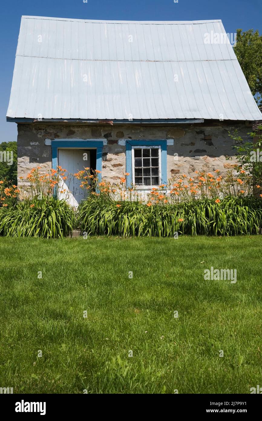 Old small circa 1775 fieldstone home with blue and white trim, grey ...