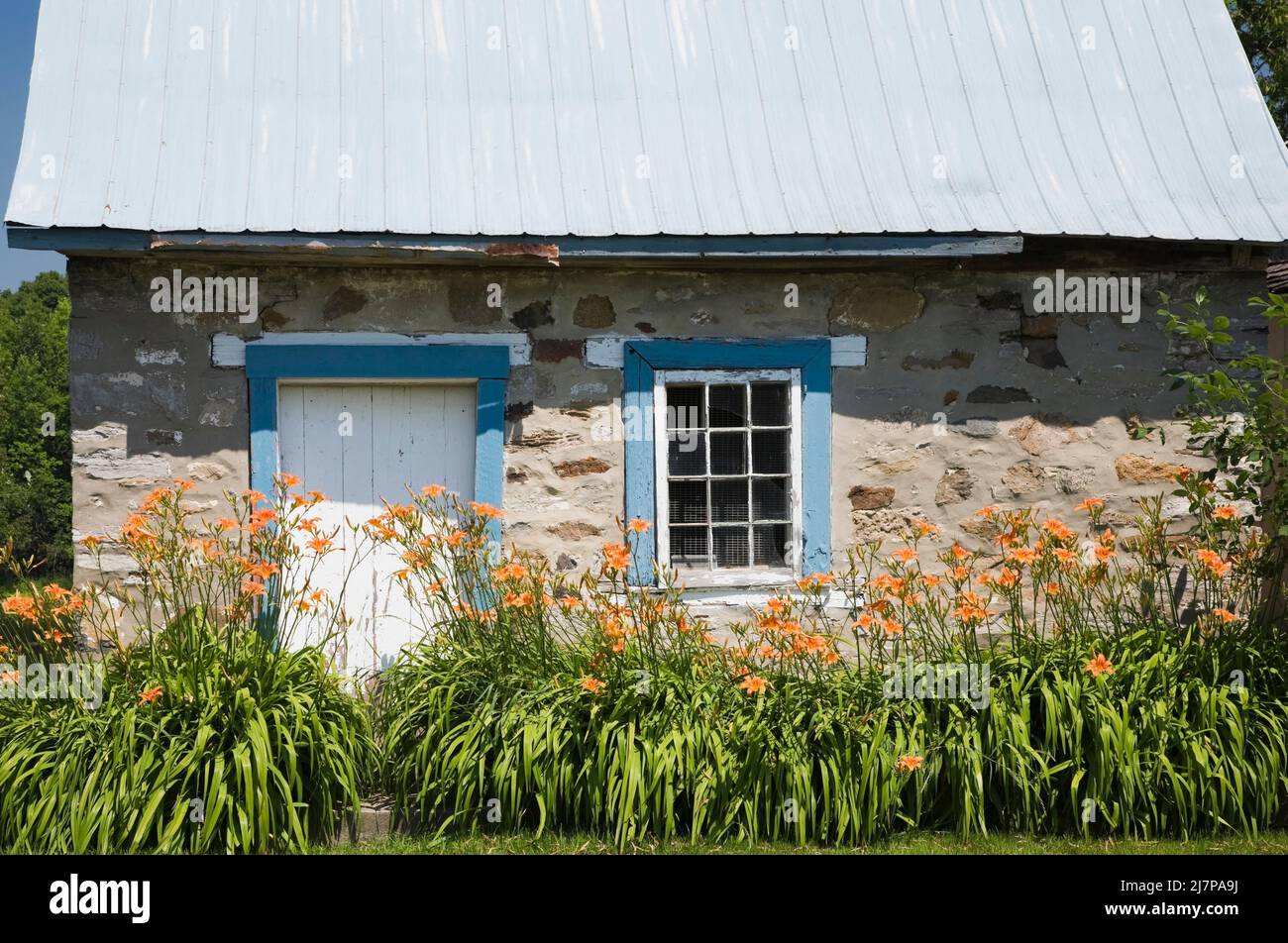 Old small circa 1775 fieldstone home with blue and white trim, grey ...