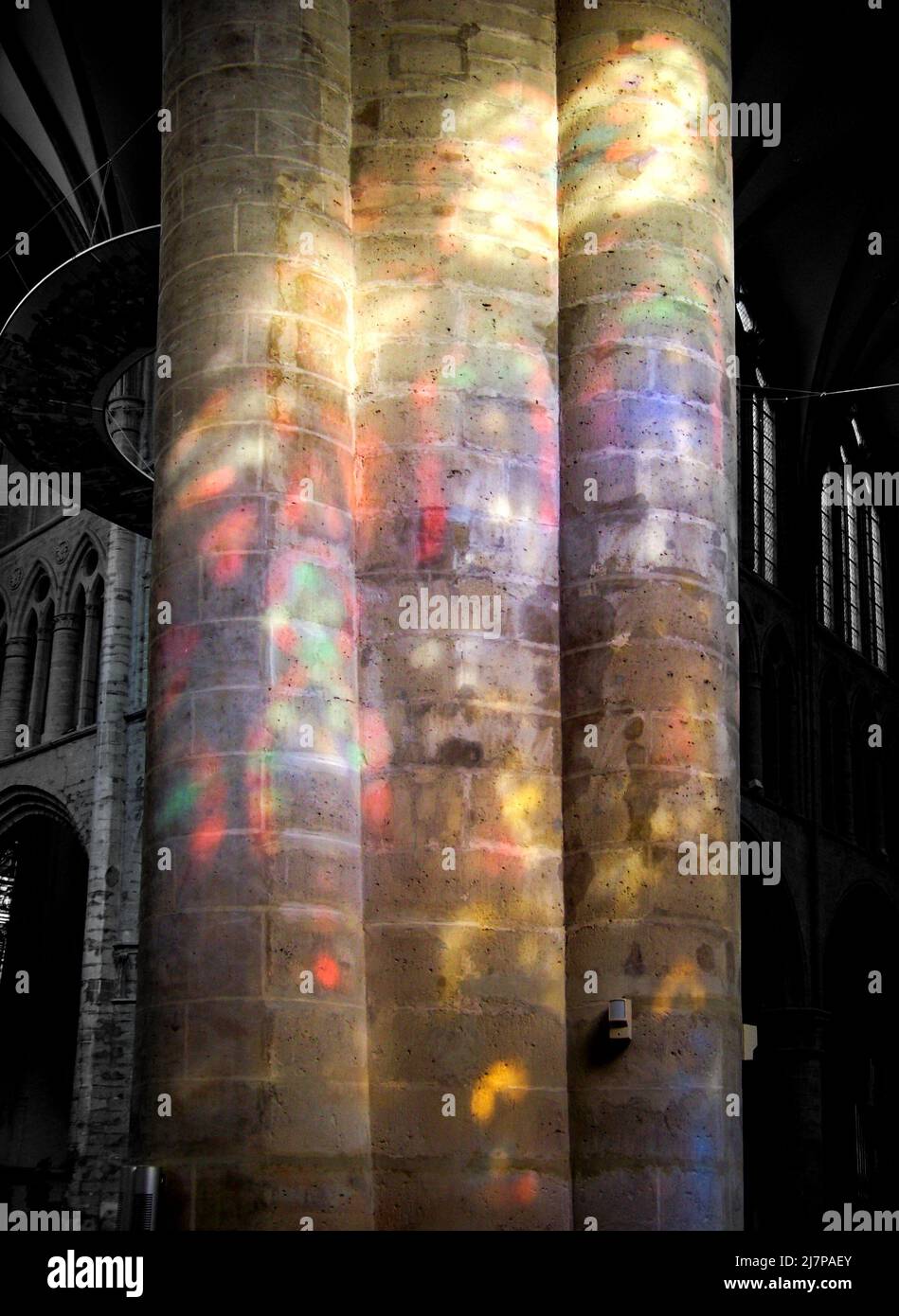 Stained glass reflection on stone columns in Christian Church Stock ...
