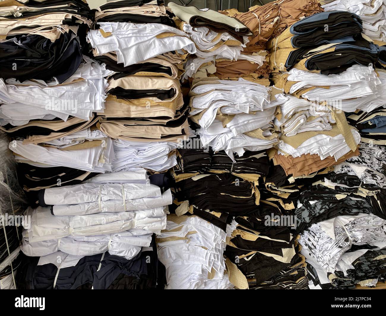 Stacks of cotton fabric. Factory for tailoring clothes. Warehouse ...