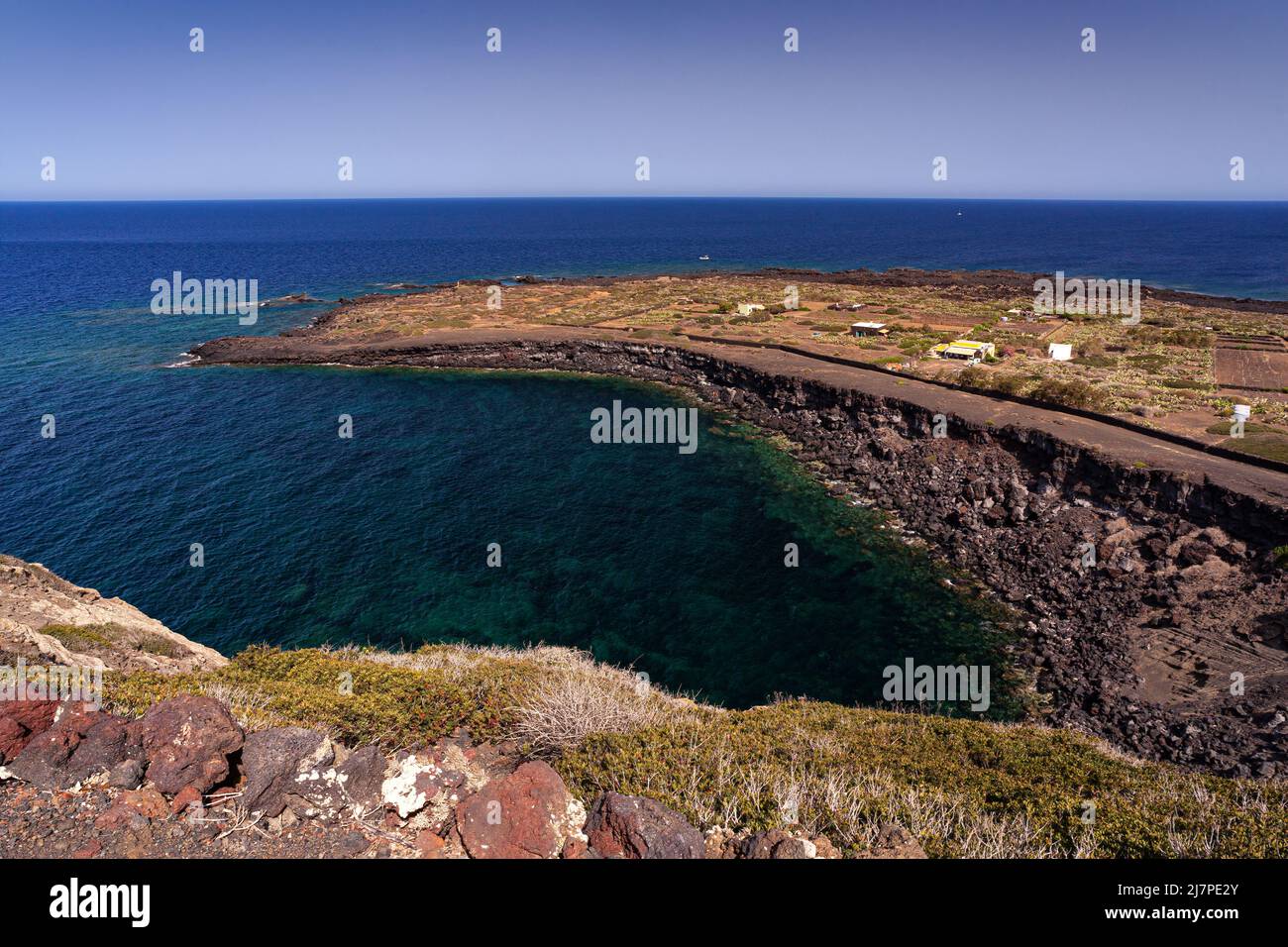 View of the scenic lava rock cliff in the Linosa island. Sicily Stock ...