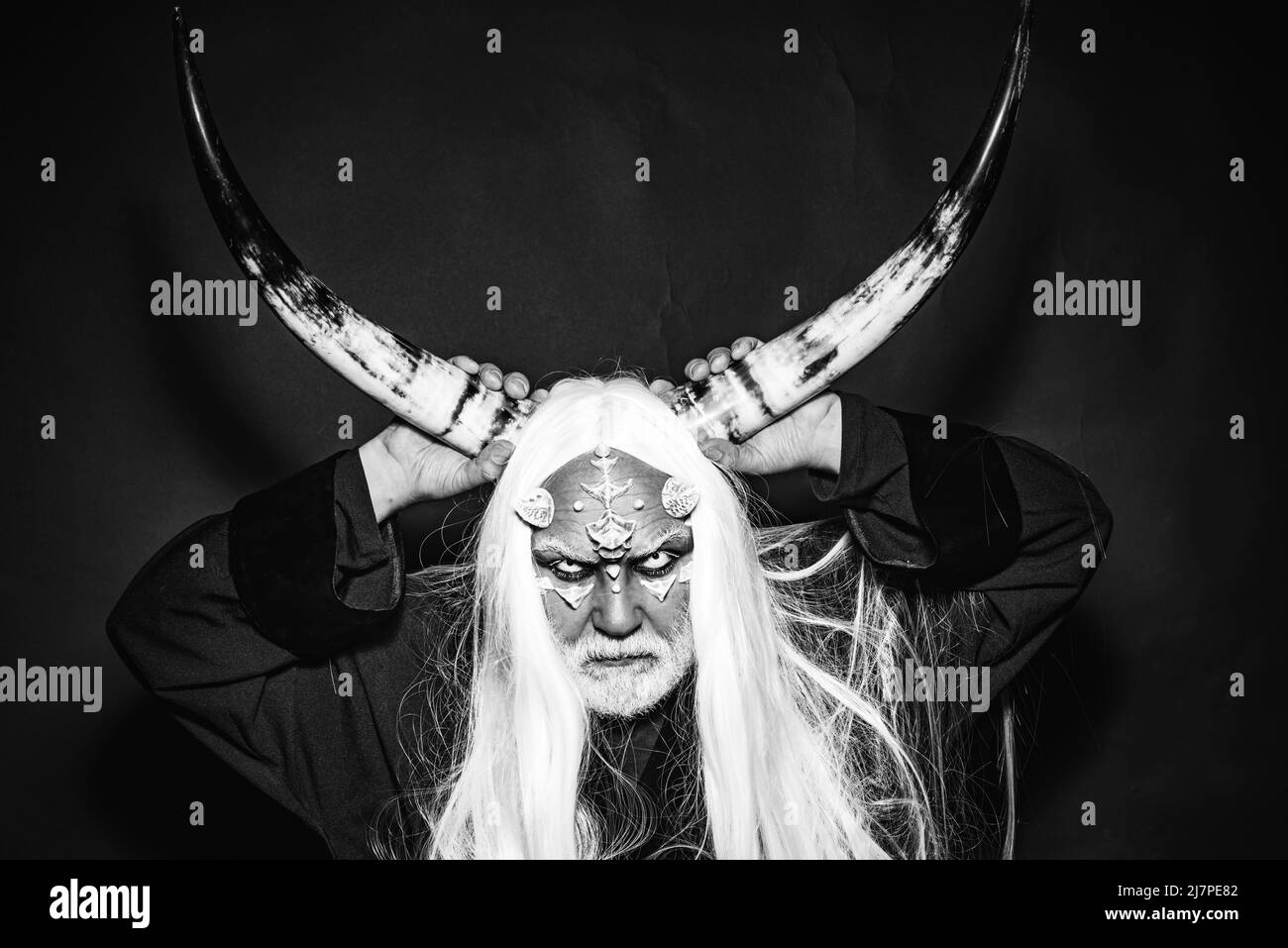 Magic and fairy tale concept. Man evil with horns. Monster with sharp ...