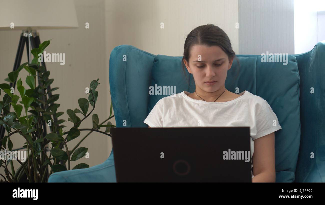 Authentic Stressful Woman working Chatting On Laptop Living Room ...