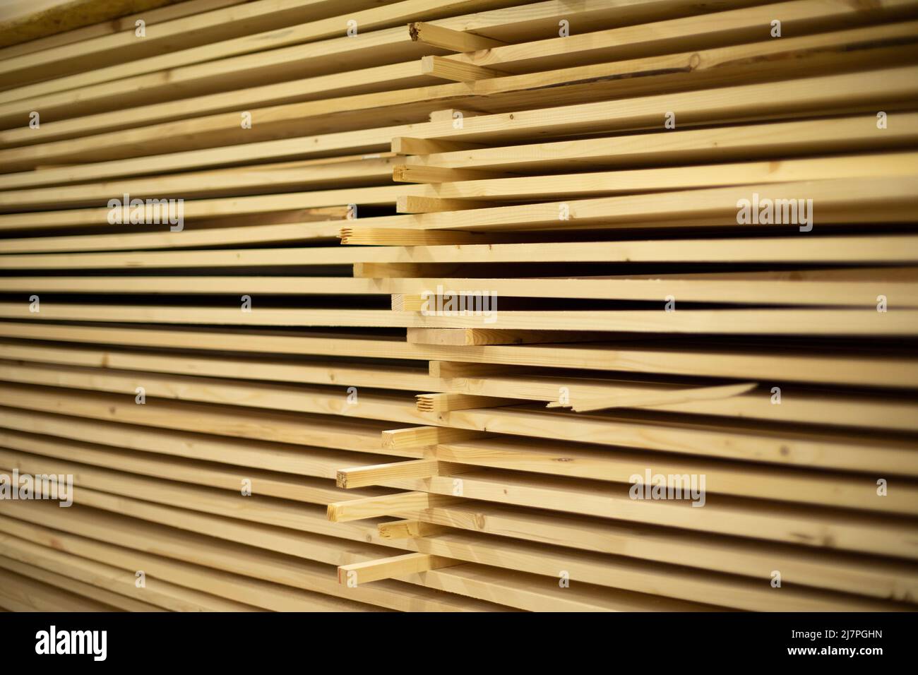 Lot of boards in carpentry workshop. Boards are stacked. Details of ...